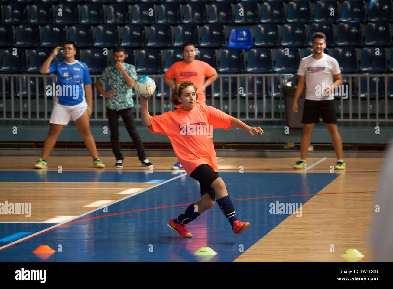 youngsters playing handball in a sports centre Stock Photo - Alamy