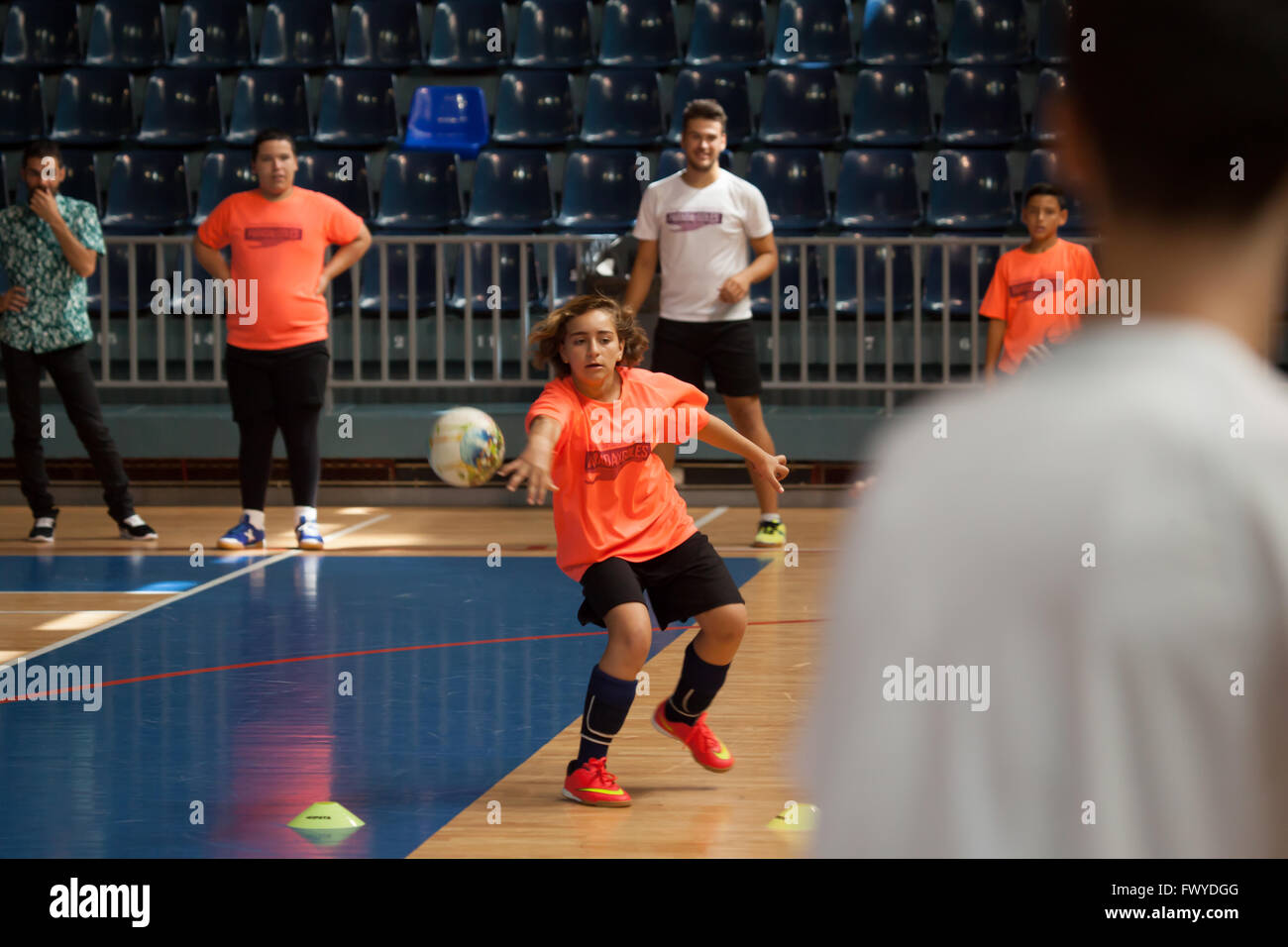 youngsters playing handball in a sports centre Stock Photo - Alamy