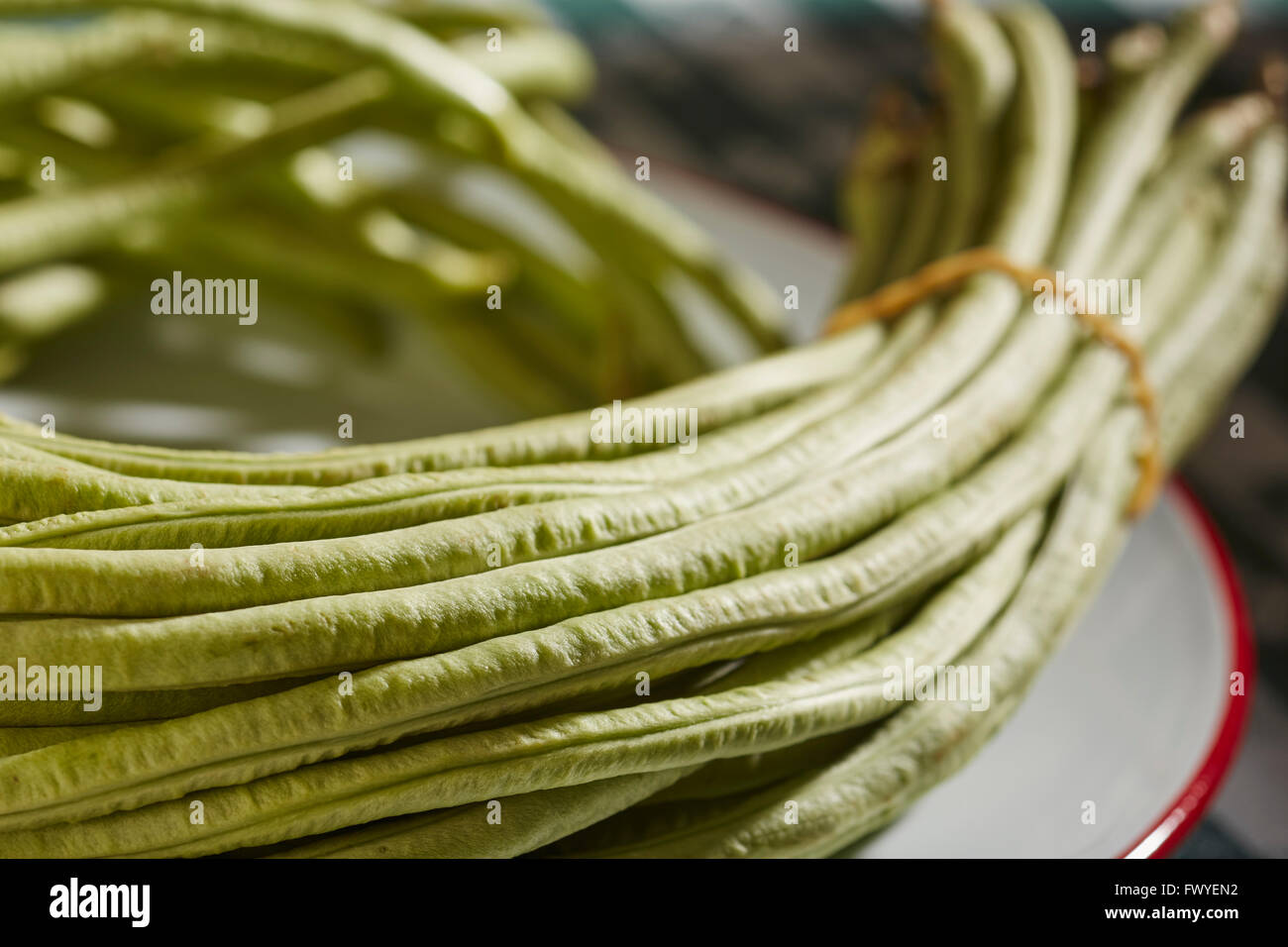 bunch of whole, raw long beans, a favorite Asian ingredient Stock Photo ...