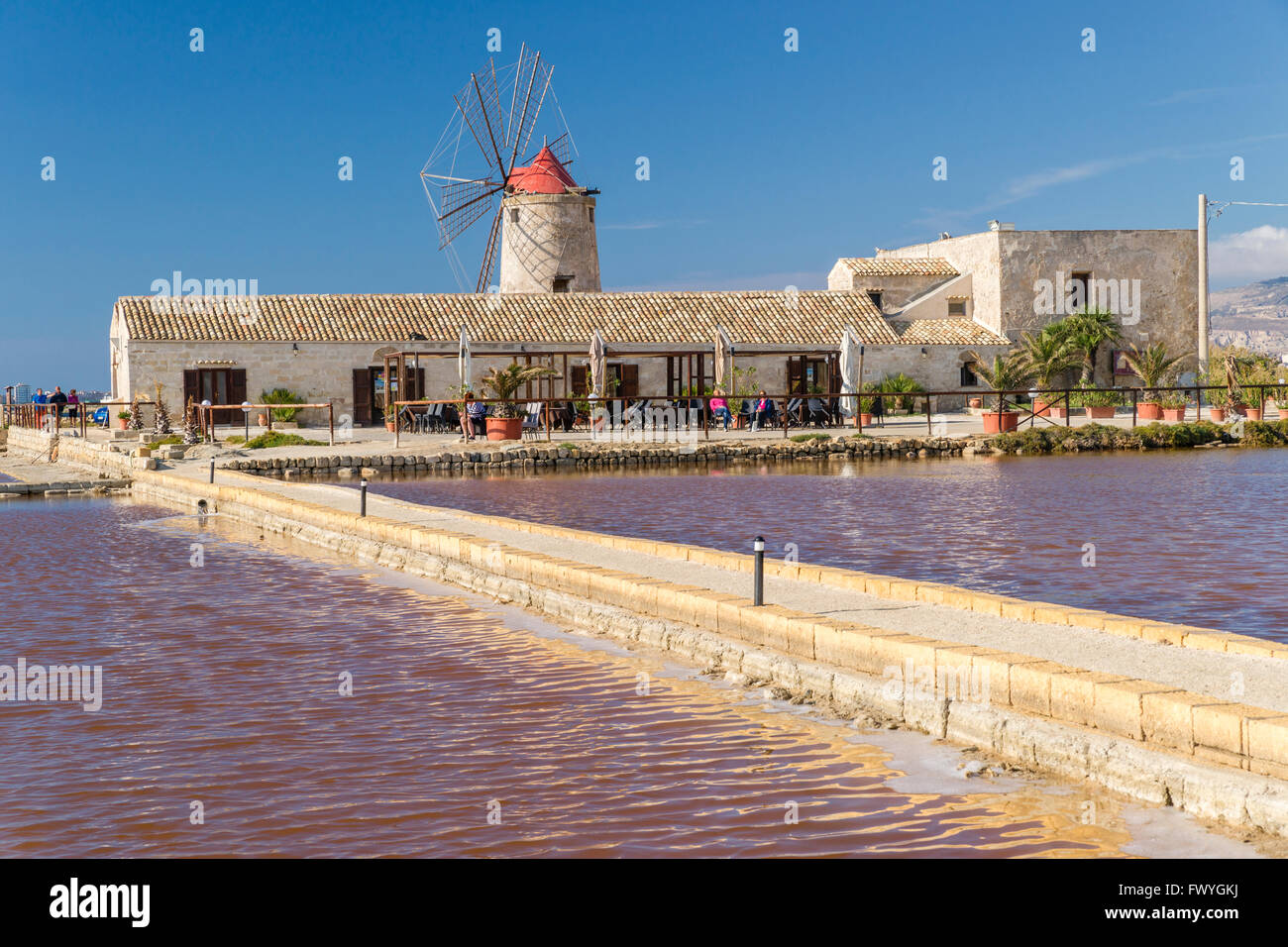 Windmill in Culcasi saltworks, Natural Reserve of saltworks with salt ...