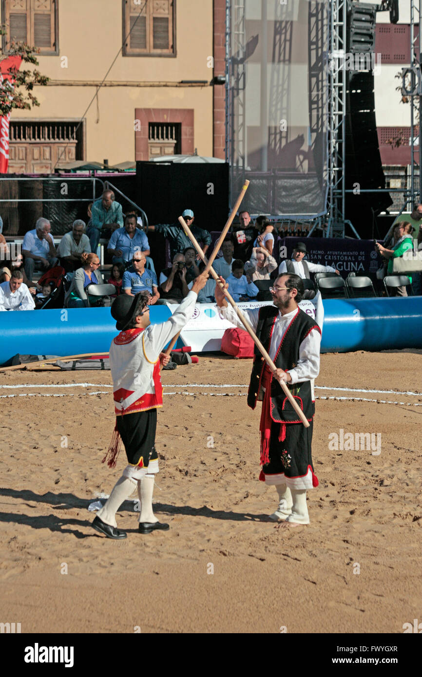 men playing the canarian stick wrestling in a public exhibition in the ...