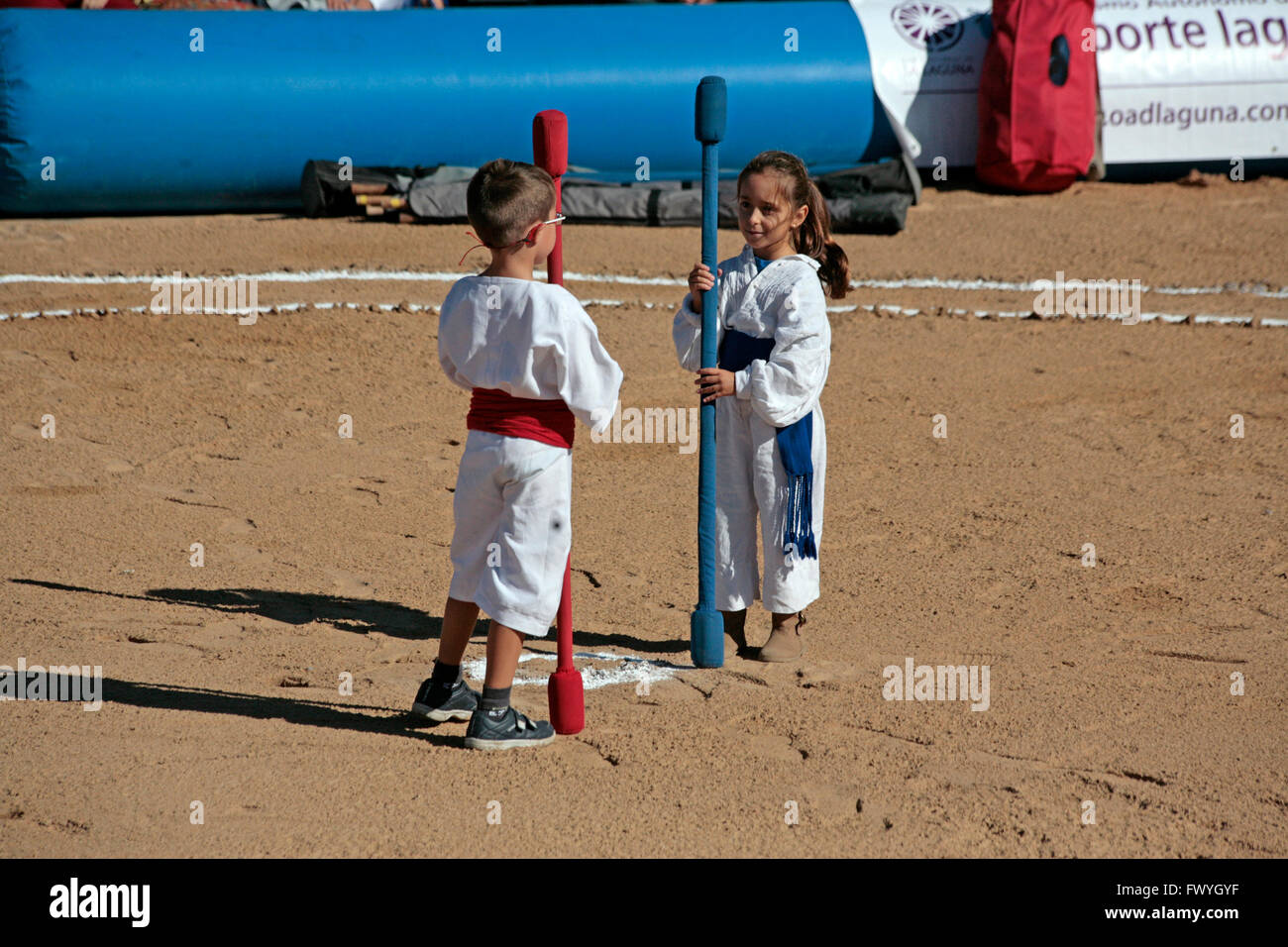 Kids playing the canarian stick wrestling in a public exhibition in the ...