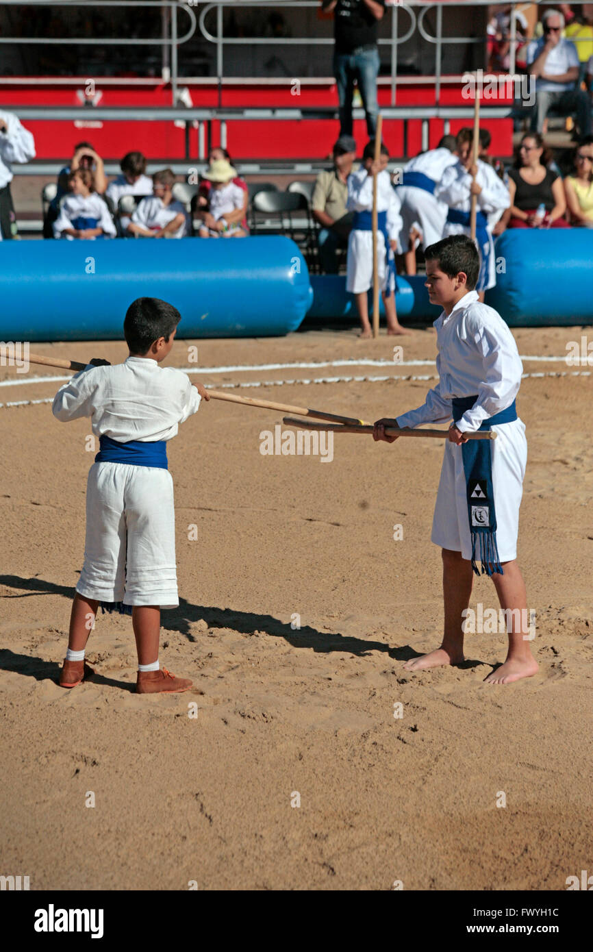 Teens playing the canarian stick wrestling in a public exhibition in ...