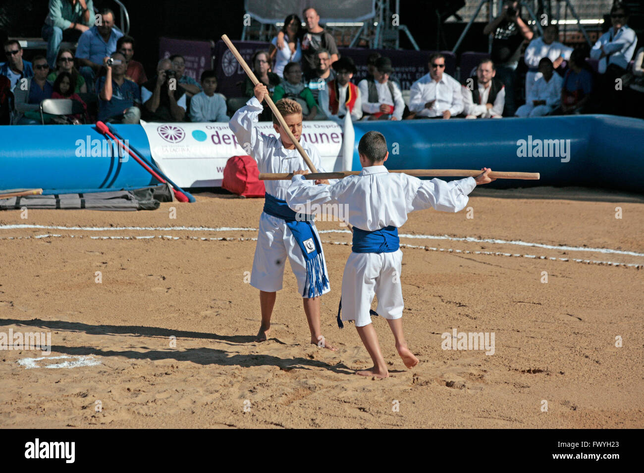 Teens playing the canarian stick wrestling in a public exhibition in ...