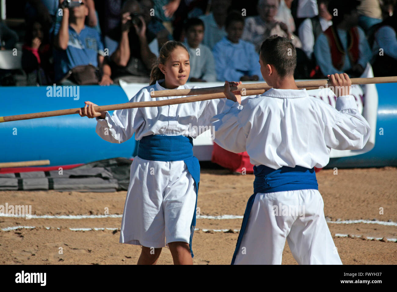 Teens playing the canarian stick wrestling in a public exhibition in ...
