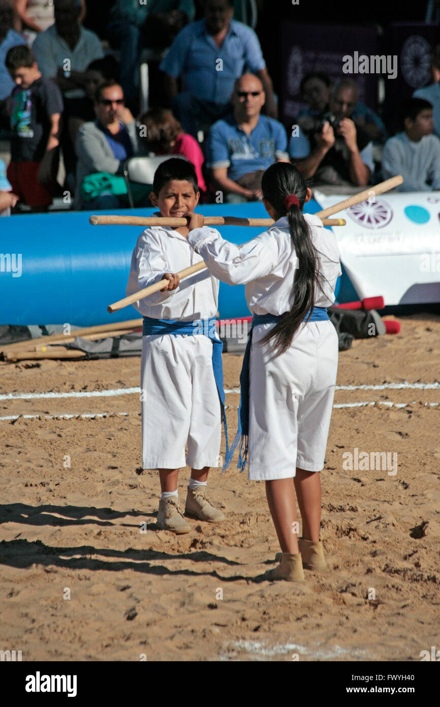 Teens playing the canarian stick wrestling in a public exhibition in ...