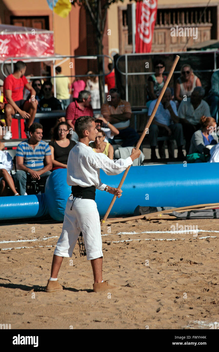 Teens playing the canarian stick wrestling in a public exhibition in ...