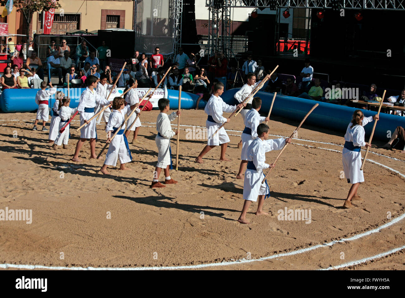 Teens playing the canarian stick wrestling in a public exhibition in ...