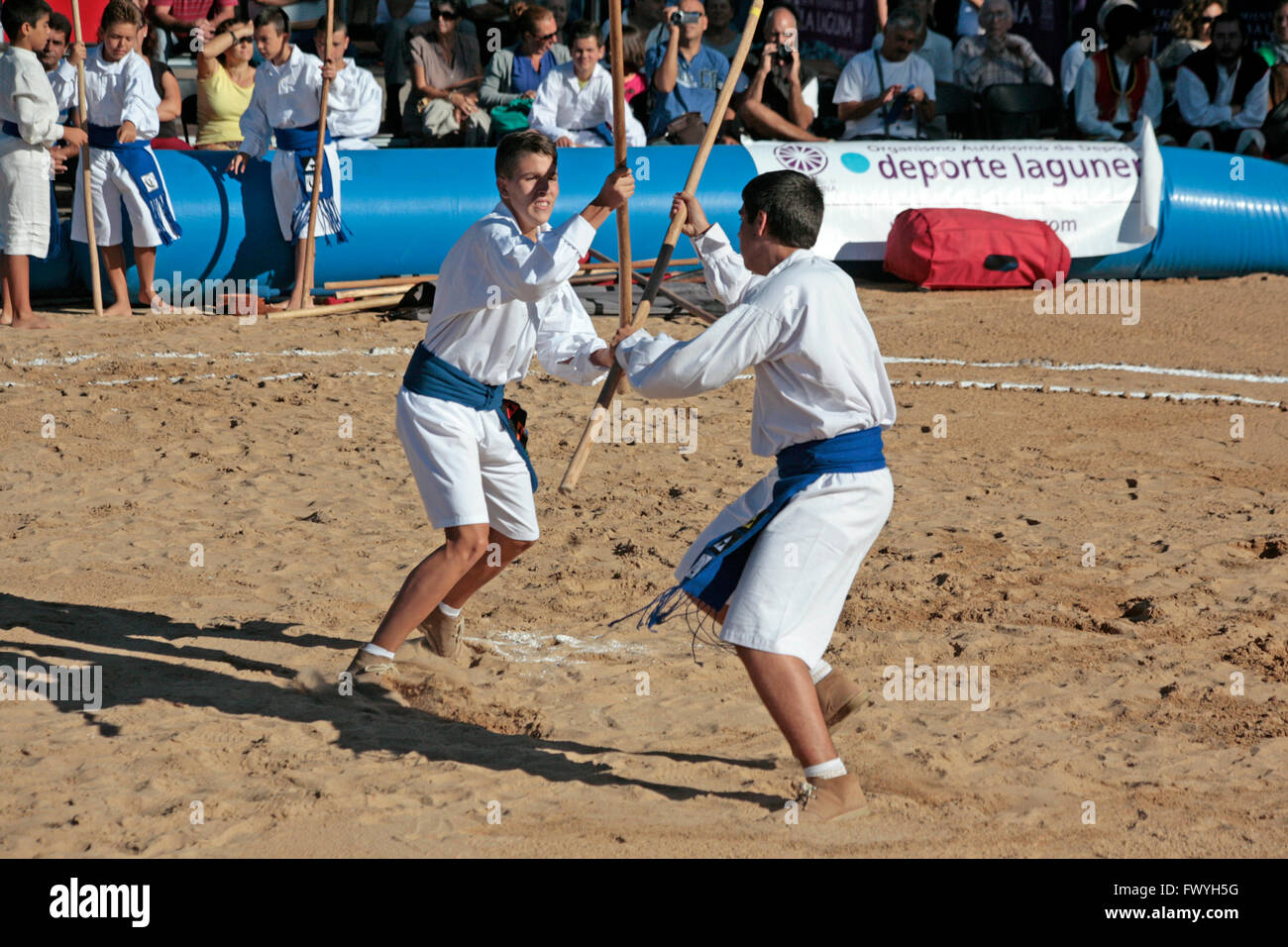 Teens playing the canarian stick wrestling in a public exhibition in ...