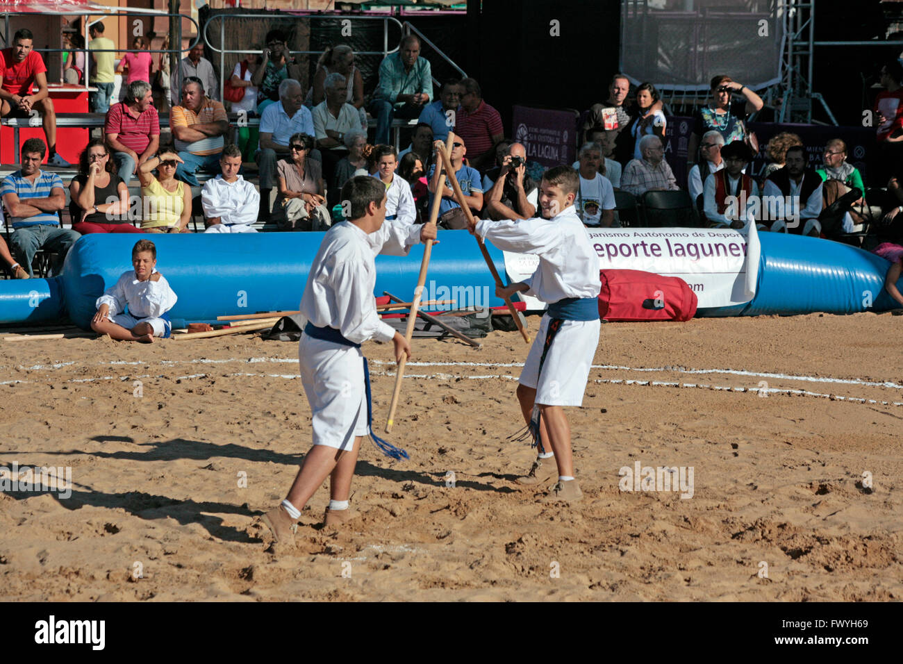 Teens playing the canarian stick wrestling in a public exhibition in ...