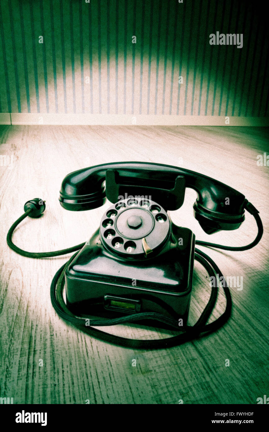 vintage analogue telephone on the floor with heavy graphic effects ...