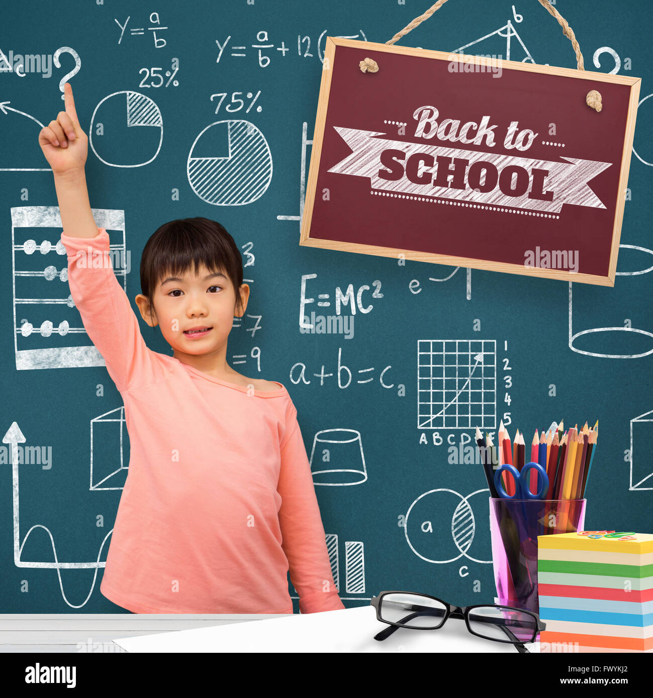 Composite image of happy pupil with hand raised Stock Photo - Alamy