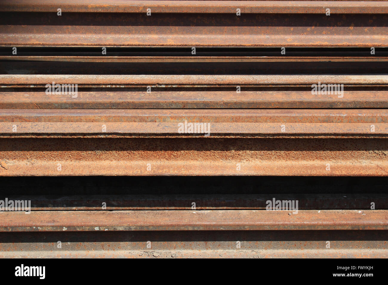 Rust covered steel railway rails at an outdoor train yard in Ibarra ...