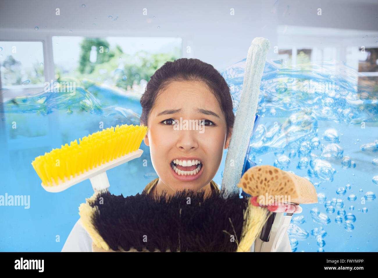 Composite image of very stressed woman with cleaning tools Stock Photo ...