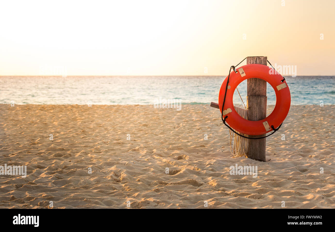 Life preserver on sandy beach somewhere in Mexico Stock Photo - Alamy