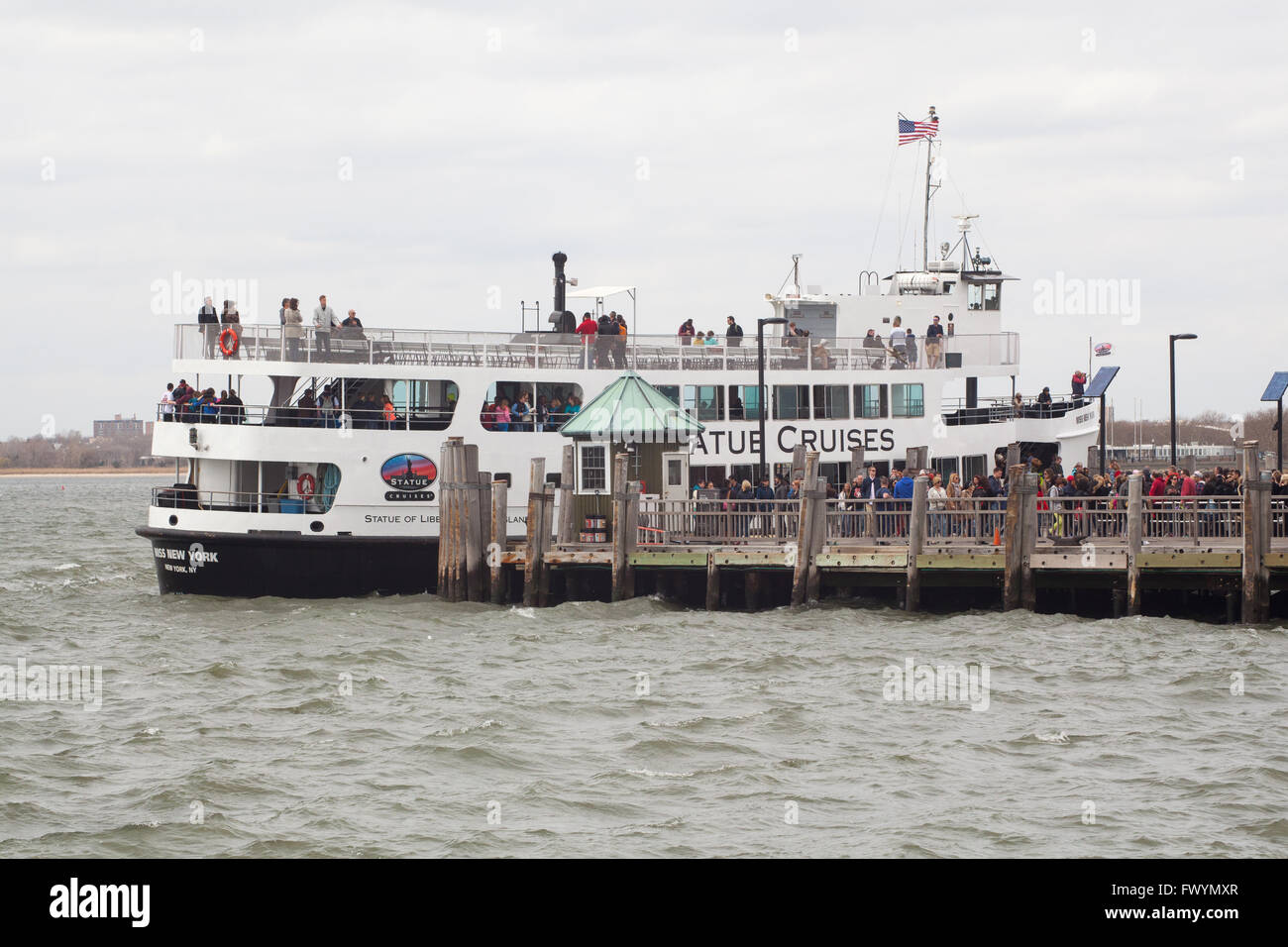 Statue Cruises ferry boat on Hudson River taking tourists to the Statue ...