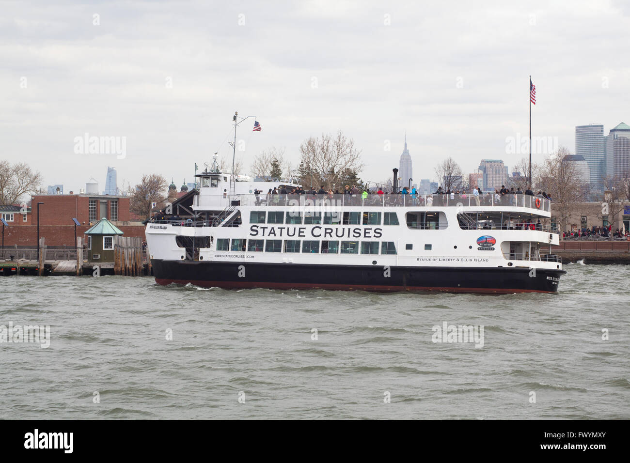 Statue Cruises passenger ferry taking tourists to the Statue of Liberty ...
