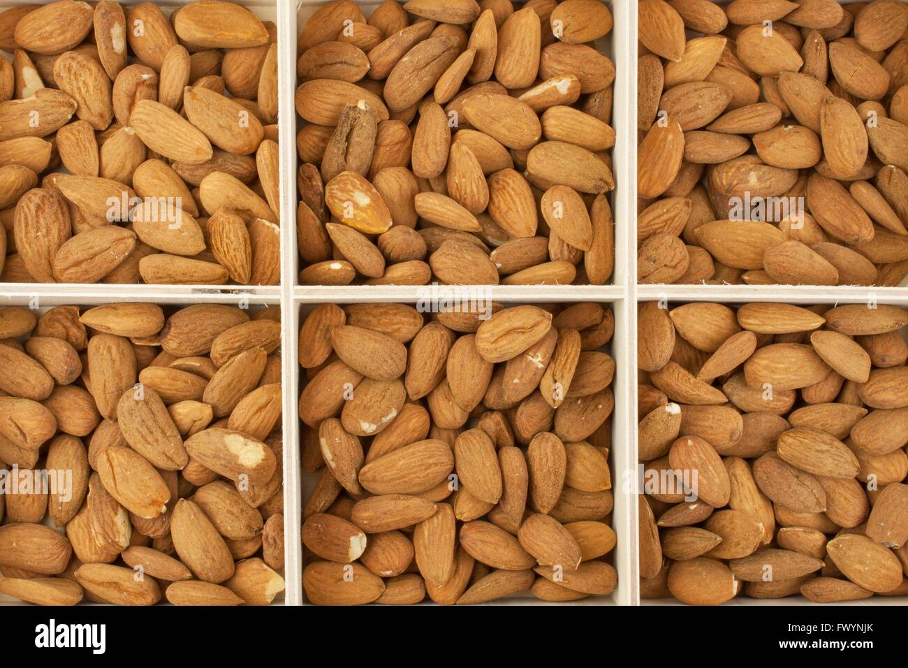 Spilled almonds. We like almonds. Healthy food Stock Photo - Alamy