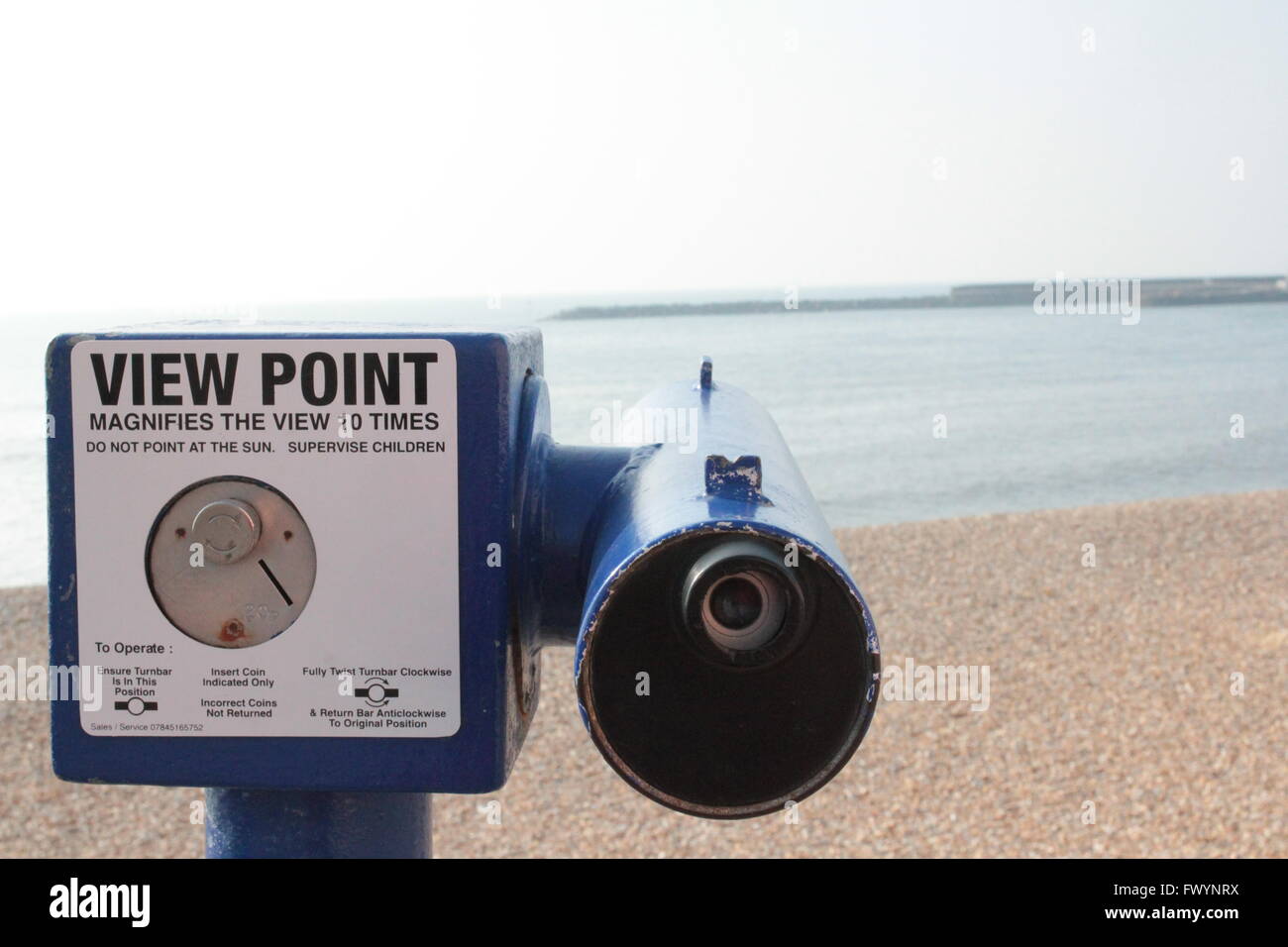 View point telescope looking at the sea Stock Photo - Alamy
