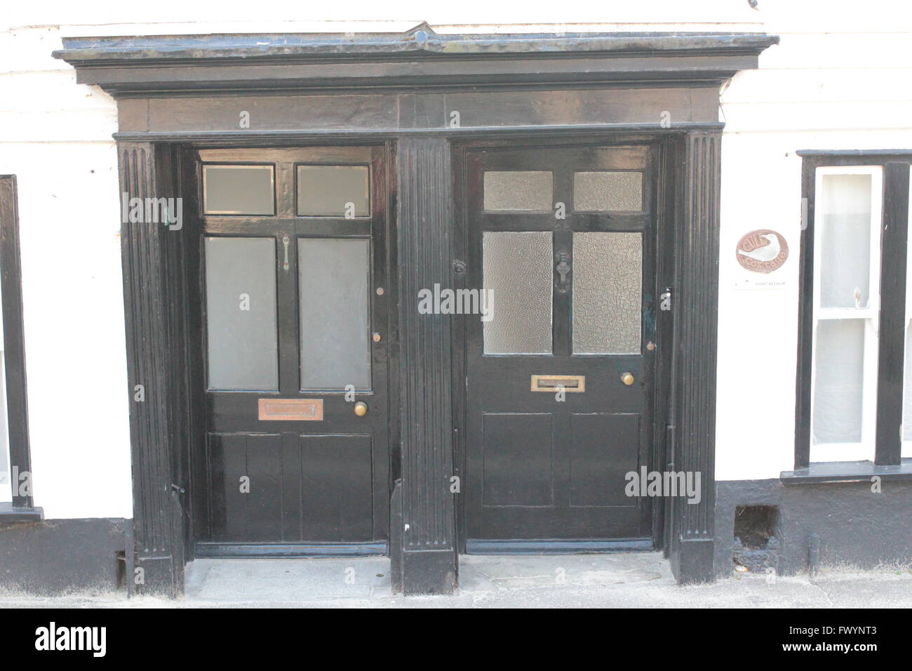 Two black doors Stock Photo - Alamy
