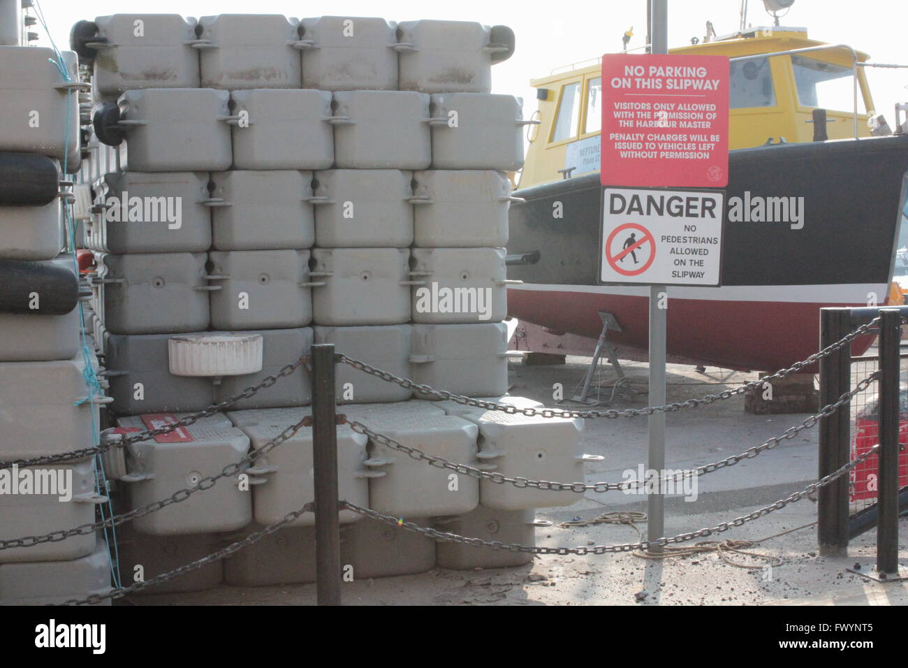 Danger sign with many flotation blocks by ship Stock Photo - Alamy