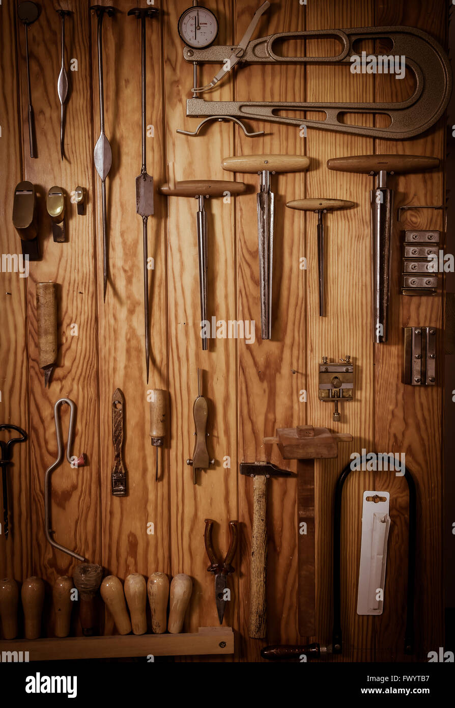 Many different old tools hanging on wall Stock Photo - Alamy