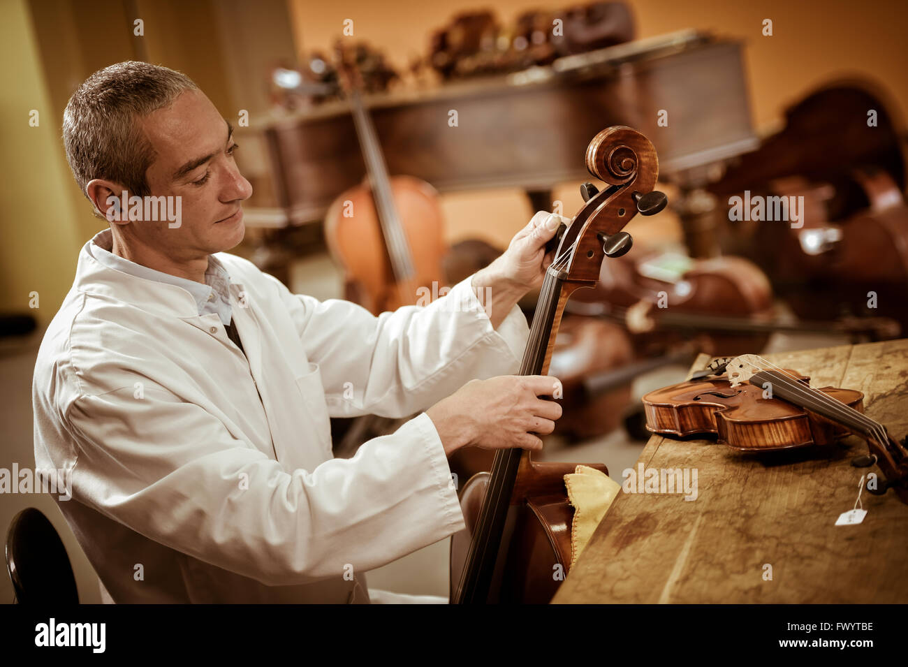 Craftsman carving violin hi-res stock photography and images - Alamy