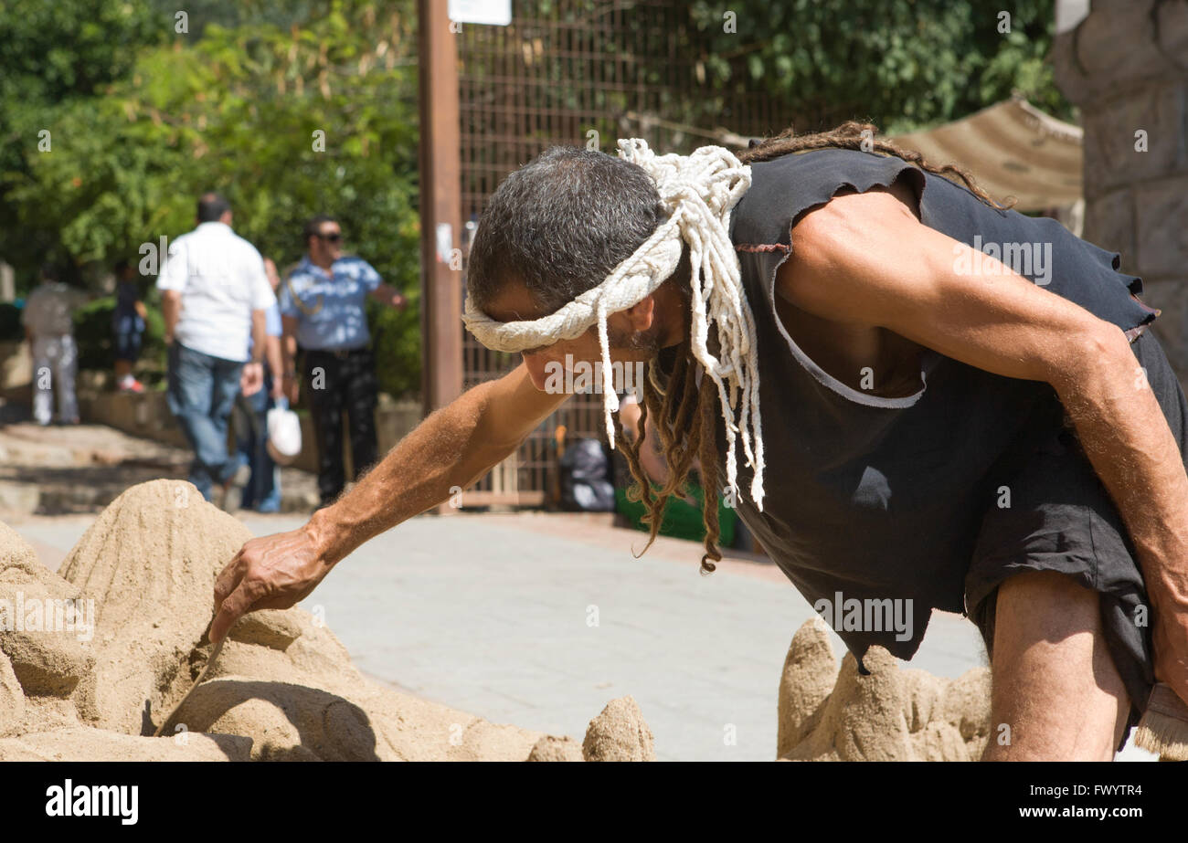 BADAJOZ, SPAIN - SEPTEMBER 25: Costumed sand man scultor working at the ...