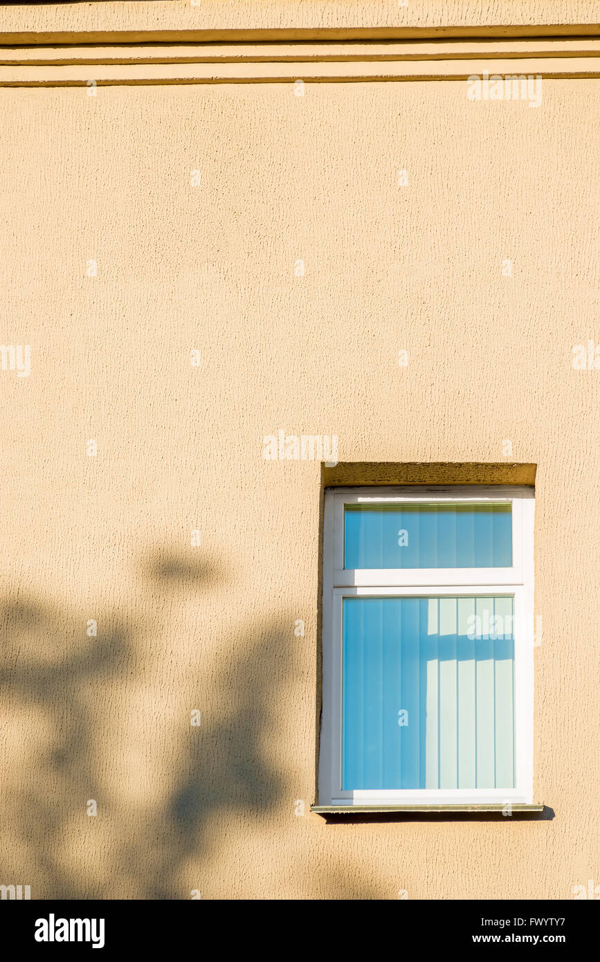 yellow wall and a window with shutters Stock Photo - Alamy