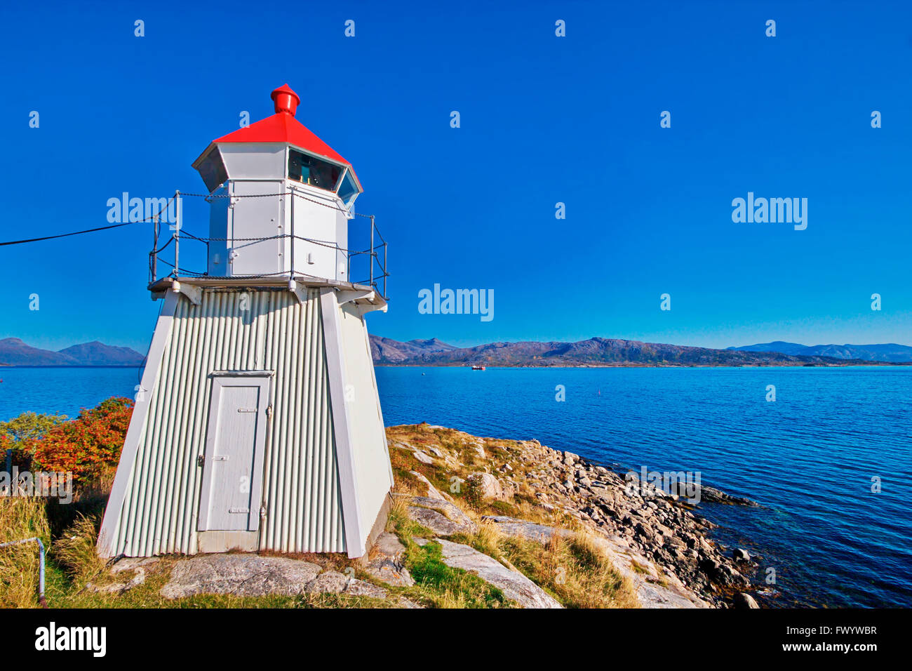 Lighthouse in Lødingen on island Hinnøya in northern Norway on a sunny ...
