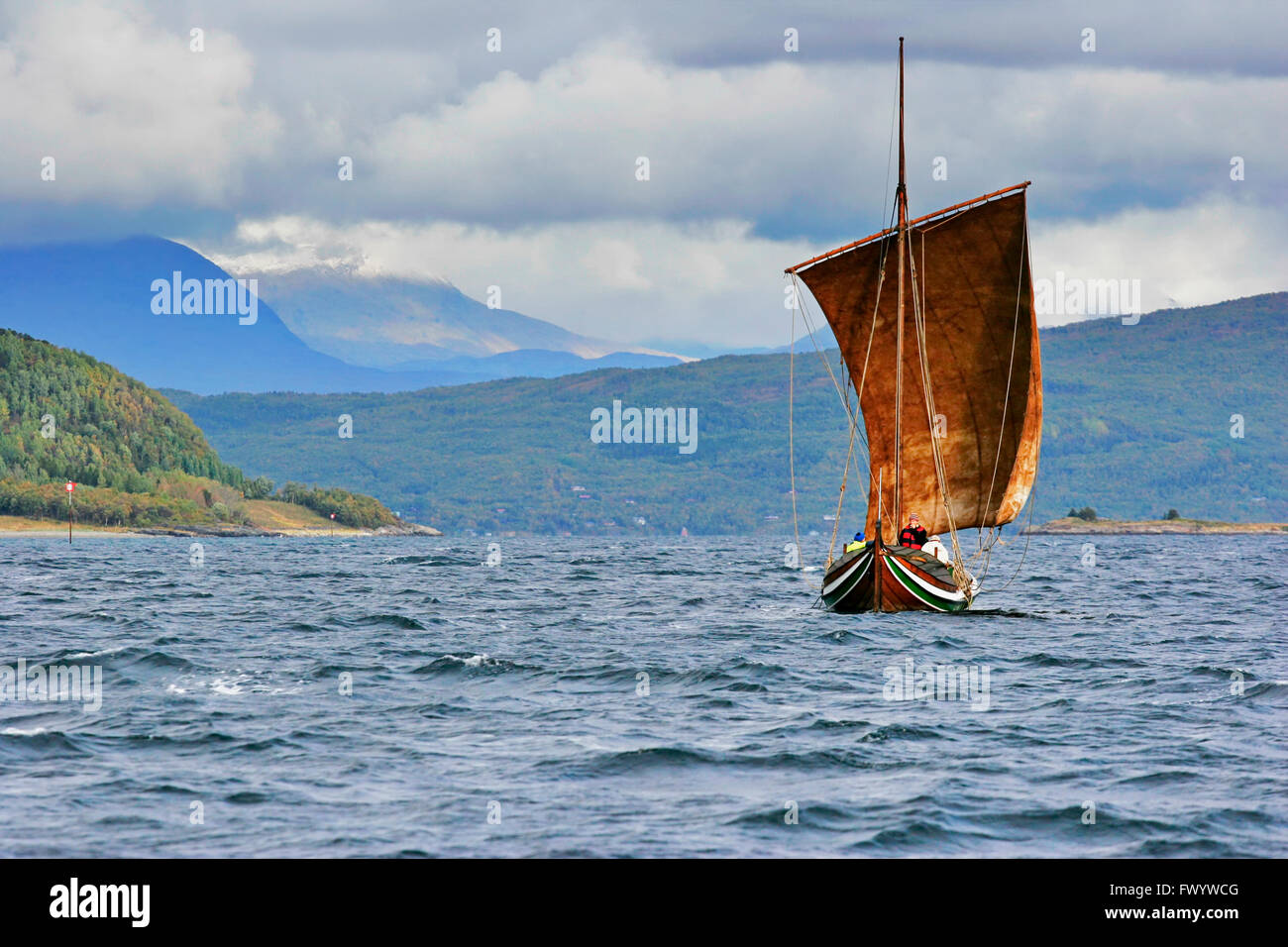 A traditional wooden Nordland boat is sailing on Ofotfjorden in ...