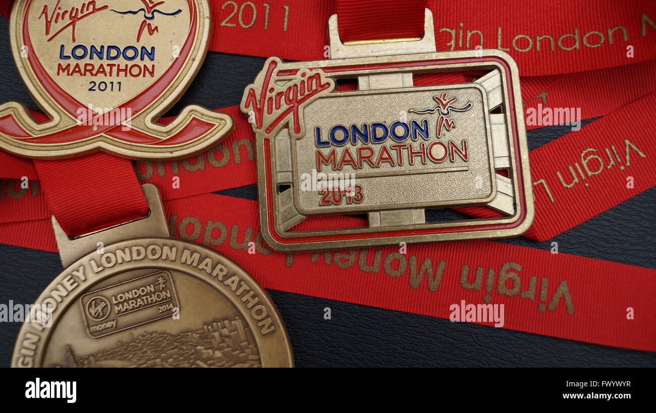Selection of different styles of London Marathon finisher medals Stock ...