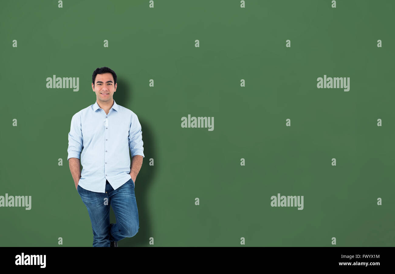 Casual man standing and smiling Stock Photo - Alamy