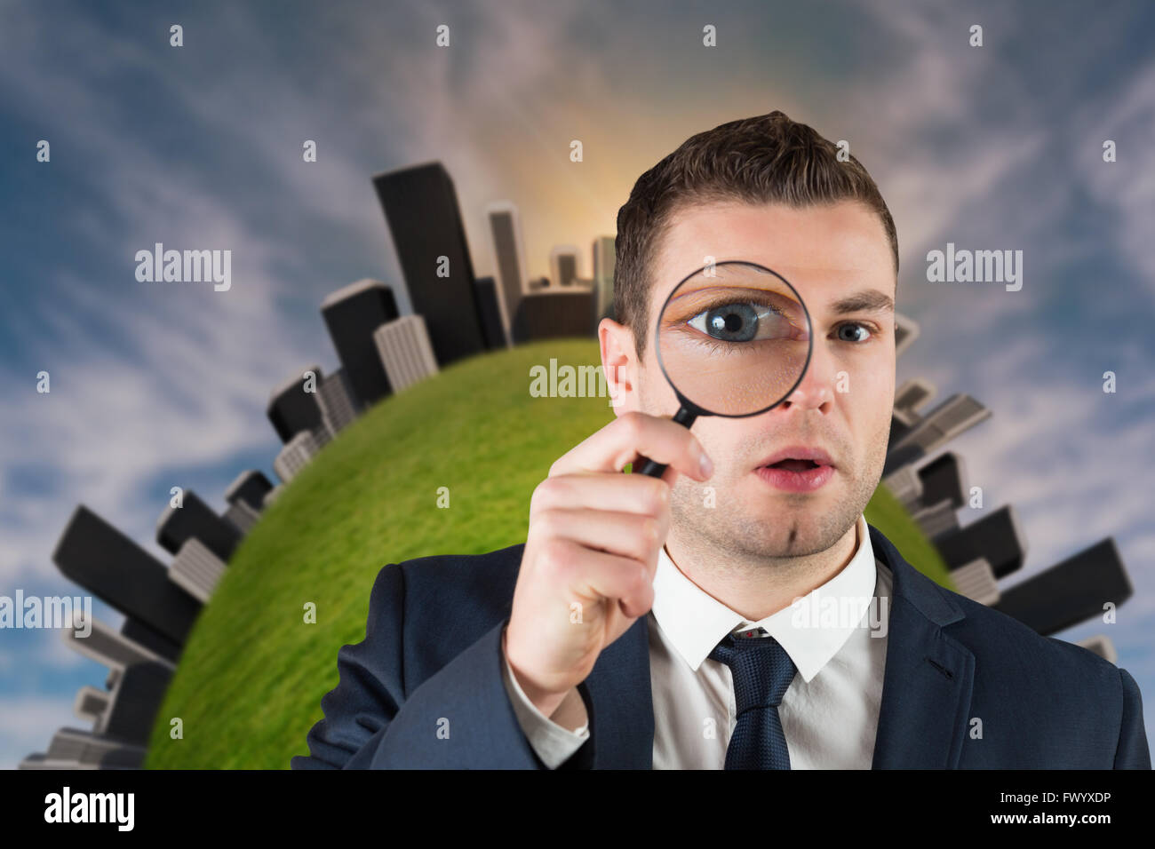 Businessman looking through magnifying glass Stock Photo - Alamy
