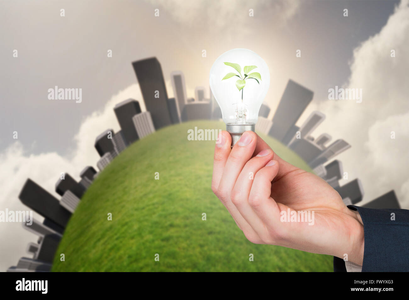 Hand holding environmental light bulb Stock Photo - Alamy