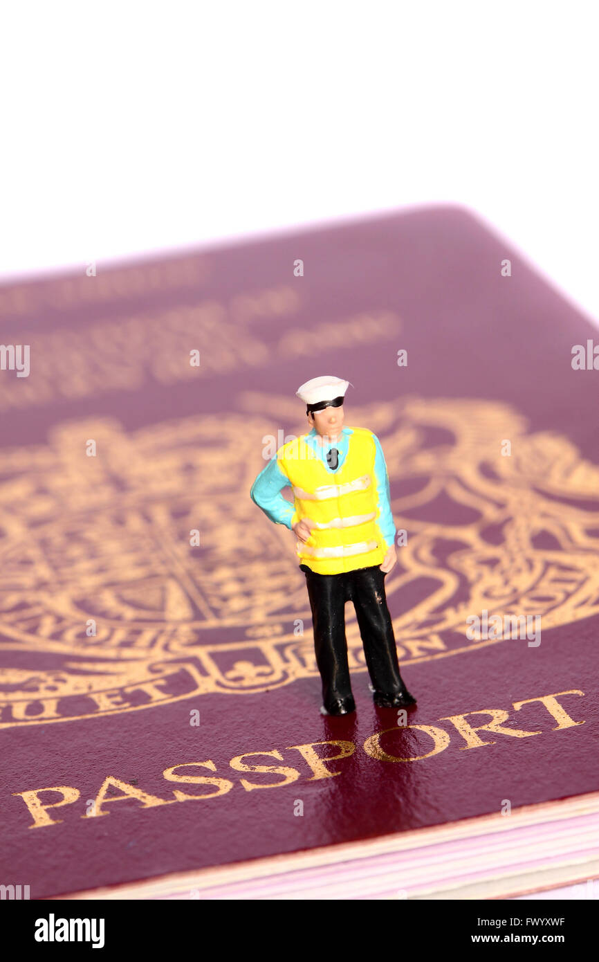 Miniature security officer passport Stock Photo - Alamy