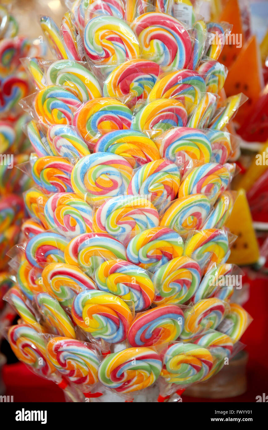 Sweet colorful lollipops on street market as a background Stock Photo ...