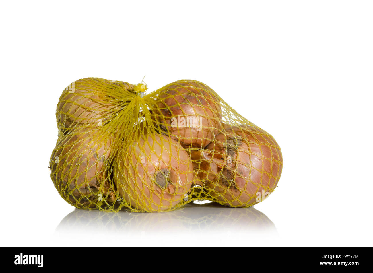 Several onions in the yellow net isolated on white background Stock ...