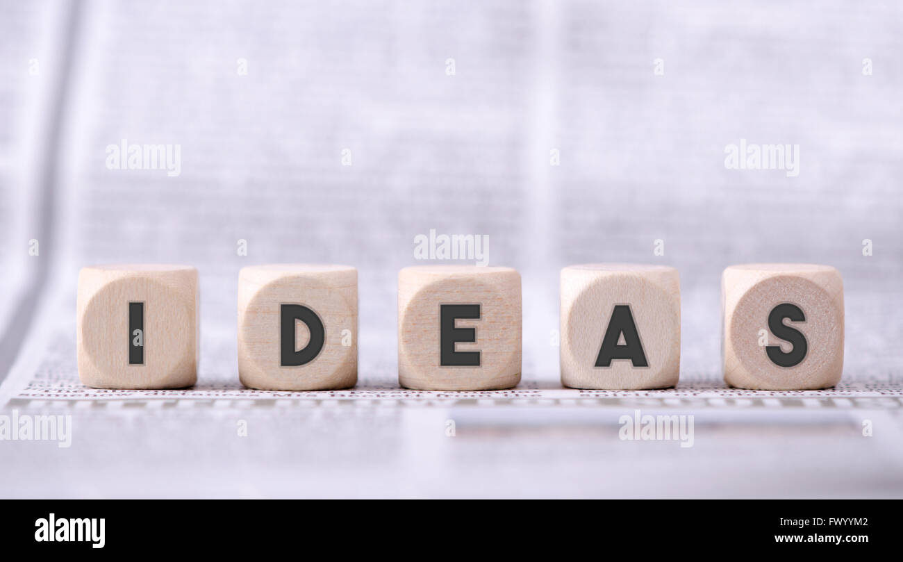 Five wooden dice with ideas word as business concept Stock Photo - Alamy