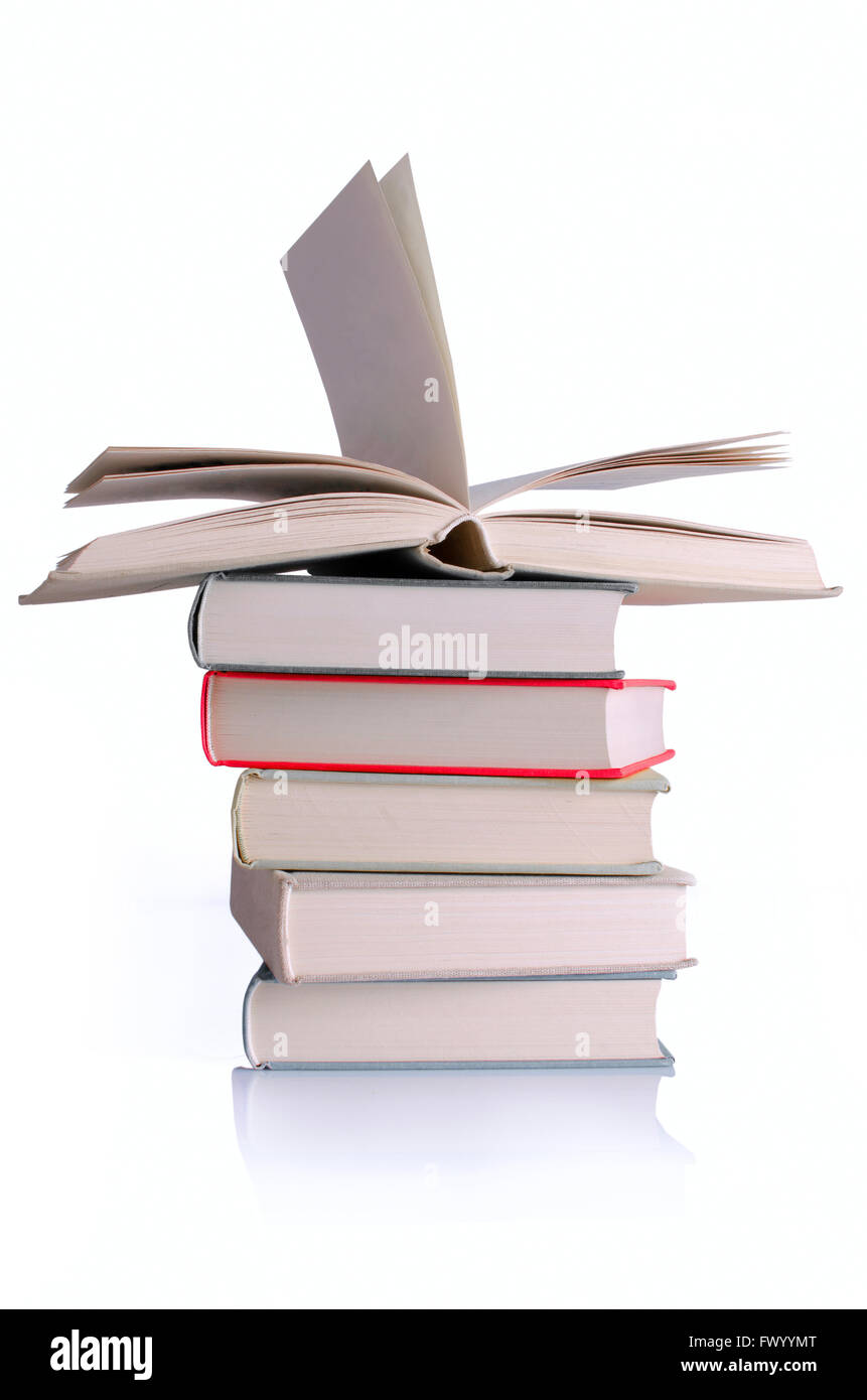 Column of books isolated on white background Stock Photo - Alamy