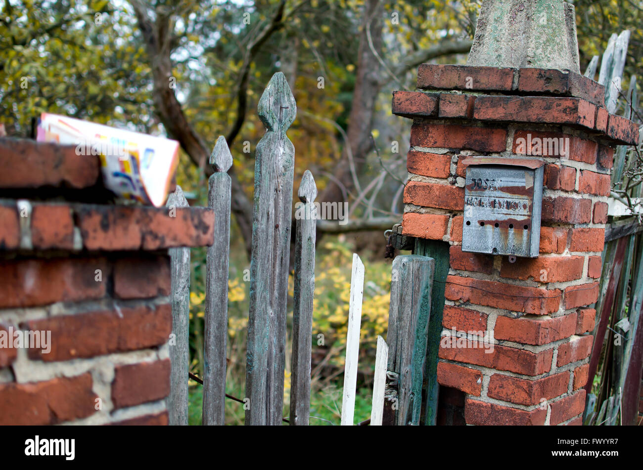 Very old rusty post box on the brick column Stock Photo - Alamy