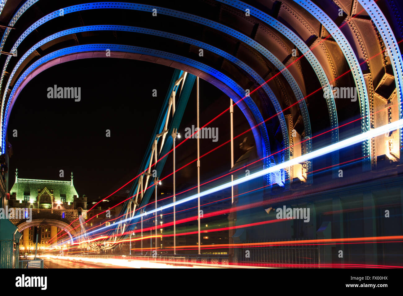 Light trails on Tower Bridge in London, UK at night time Stock Photo ...