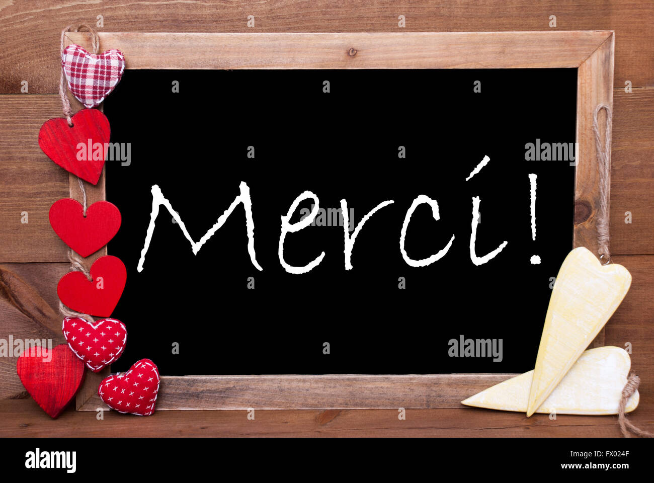 One Chalkbord, Red And Yellow Hearts, Merci Means Thank You Stock Photo ...