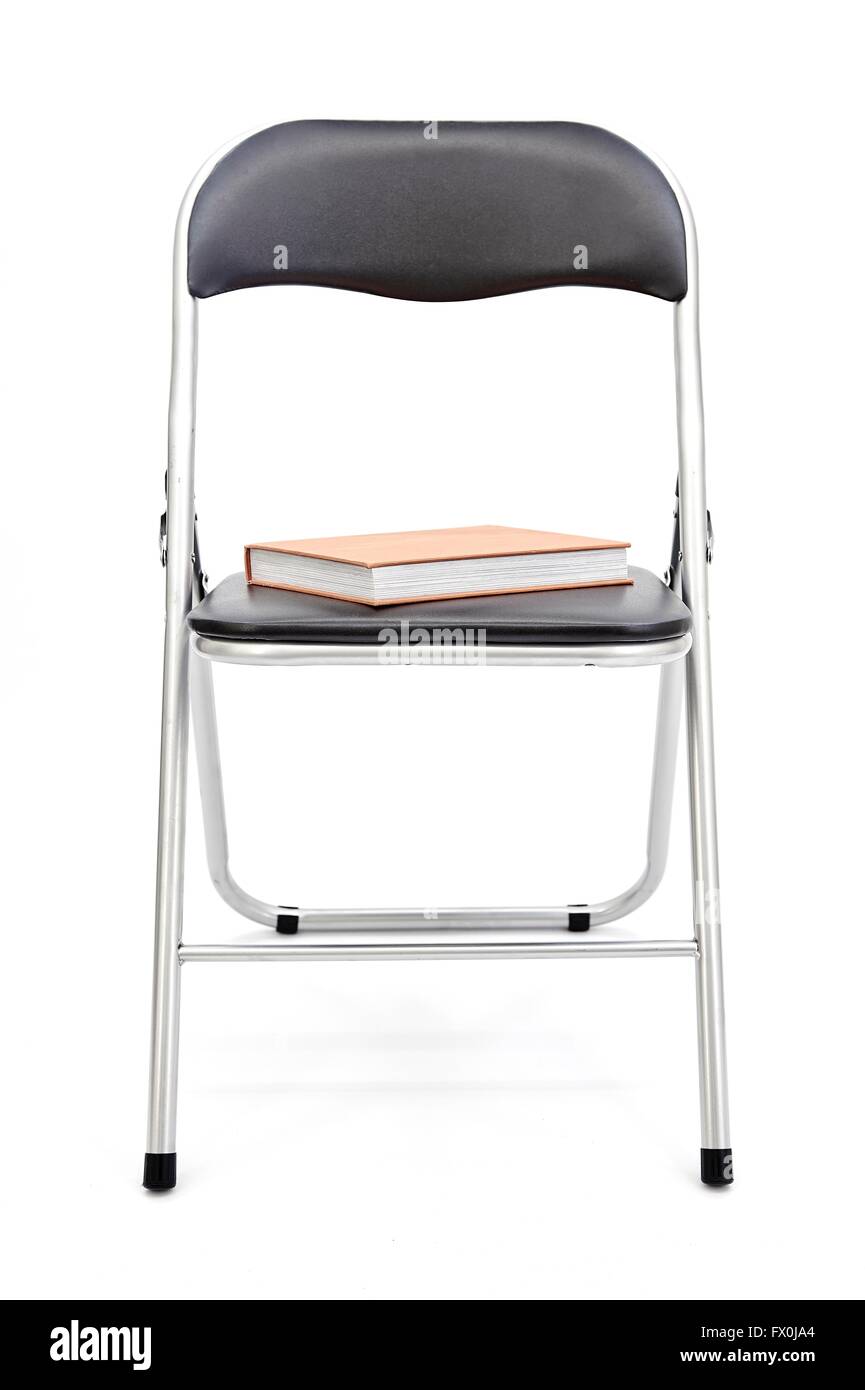 A studio photo of a black fordable chair Stock Photo - Alamy