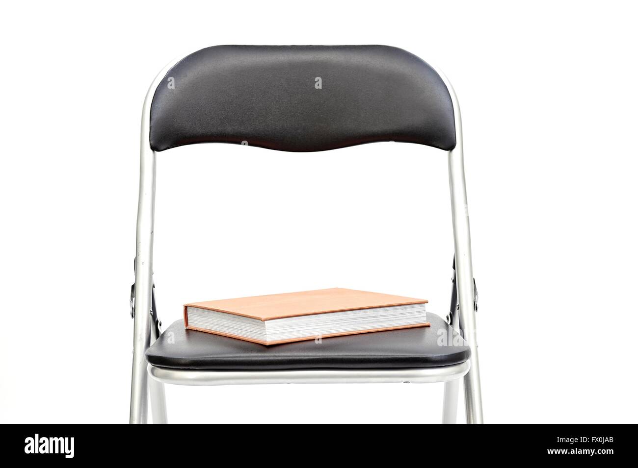 A studio photo of a black fordable chair Stock Photo - Alamy