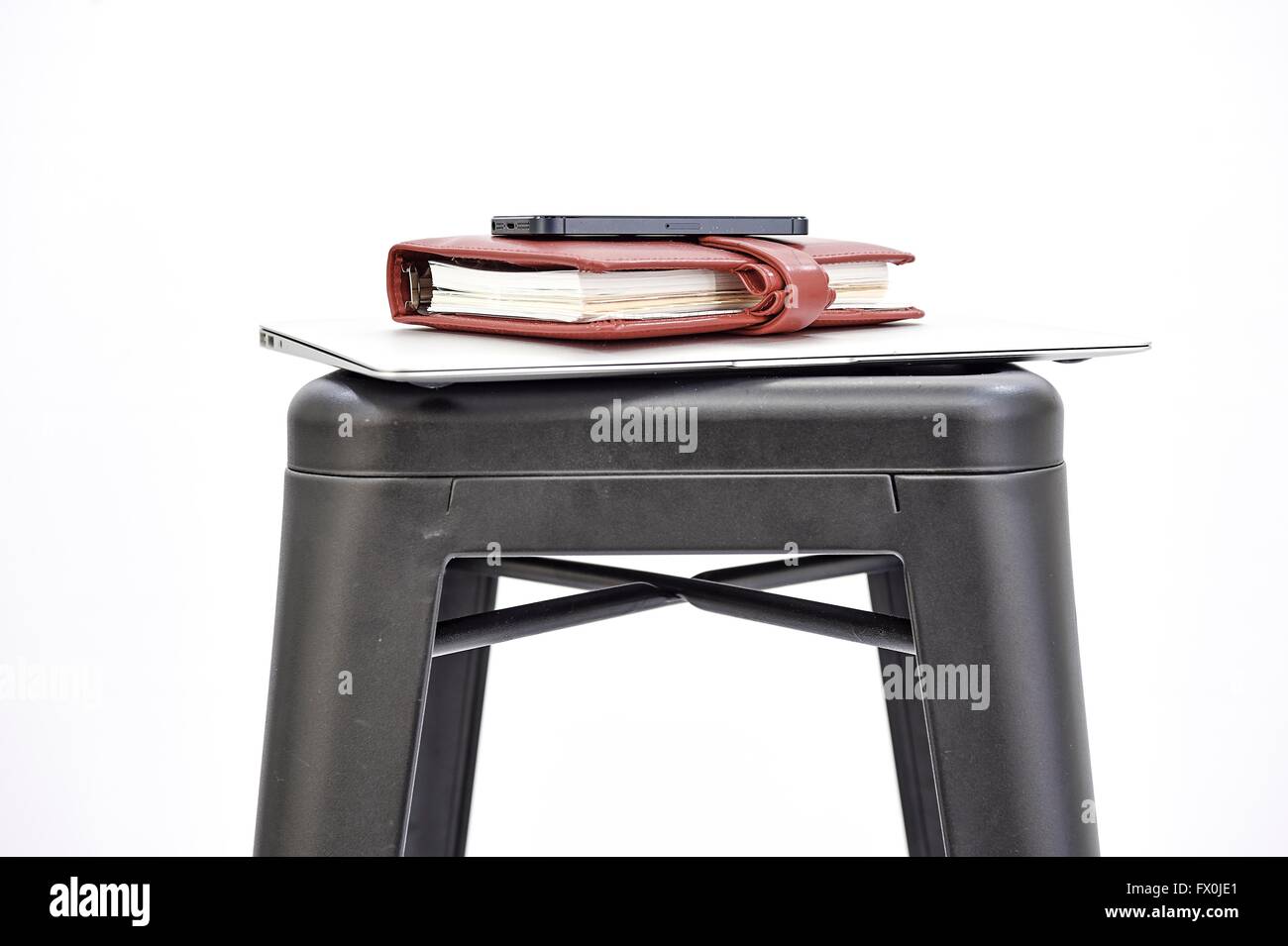 A studio photo of a black metal stool Stock Photo - Alamy