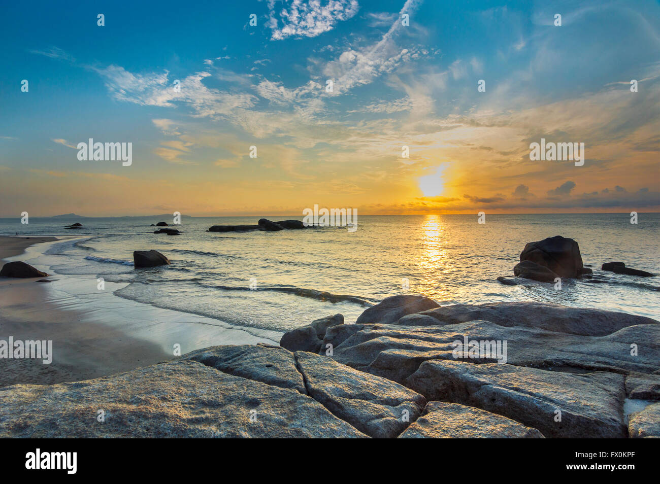 Beach rock and wave with sunrise skies background Stock Photo - Alamy