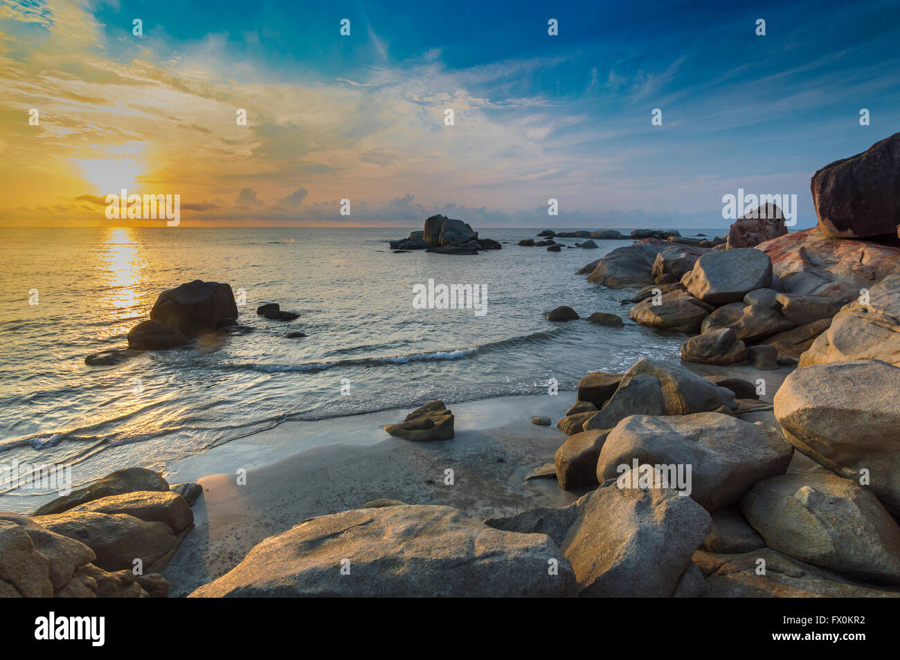 Beach rock and wave with sunrise skies background Stock Photo - Alamy