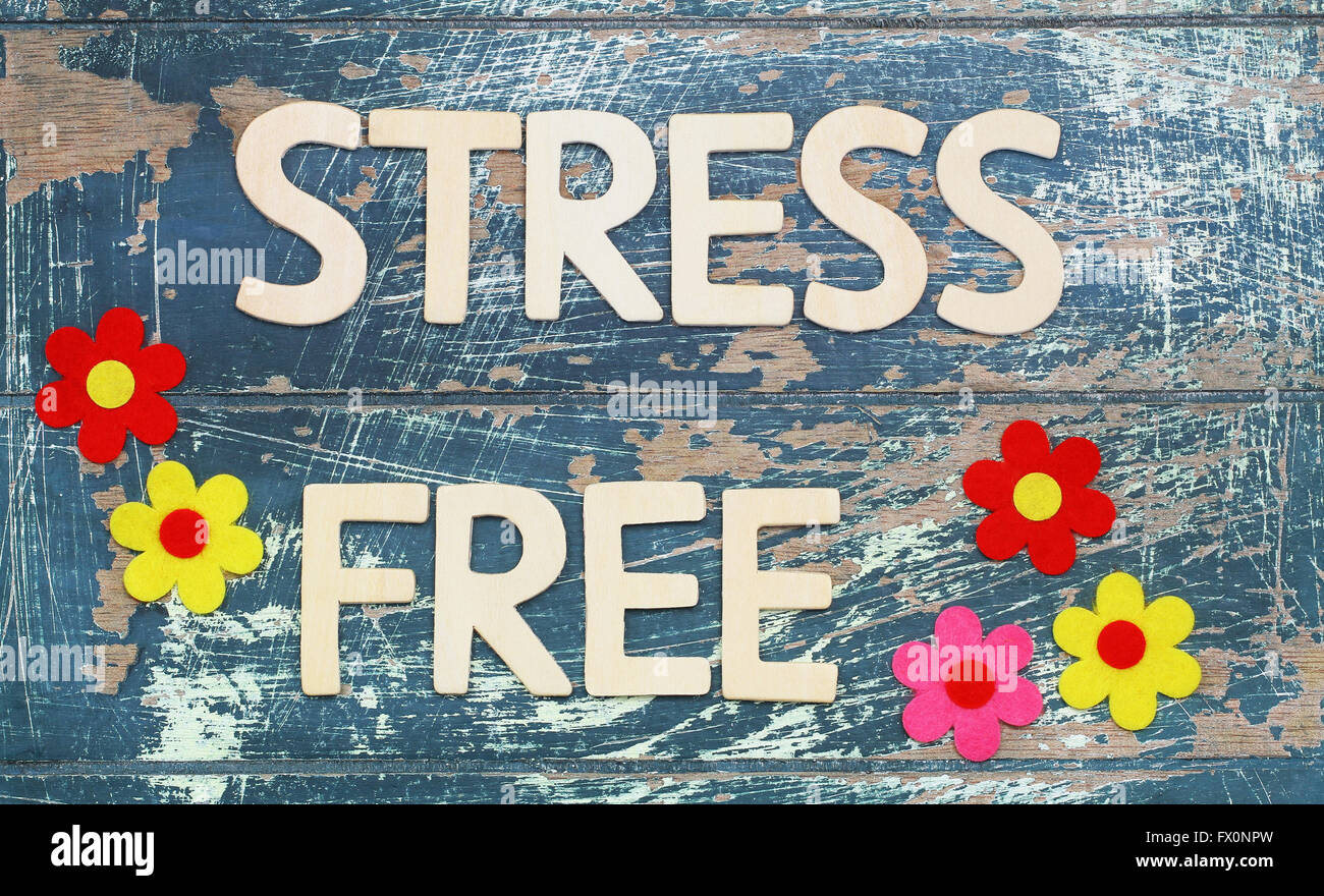 Stress free written with wooden letters on rustic wooden surface and ...