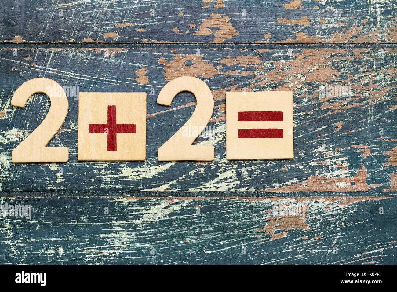 Simple mathematical equation, 2 plus 2, on rustic wooden surface Stock ...
